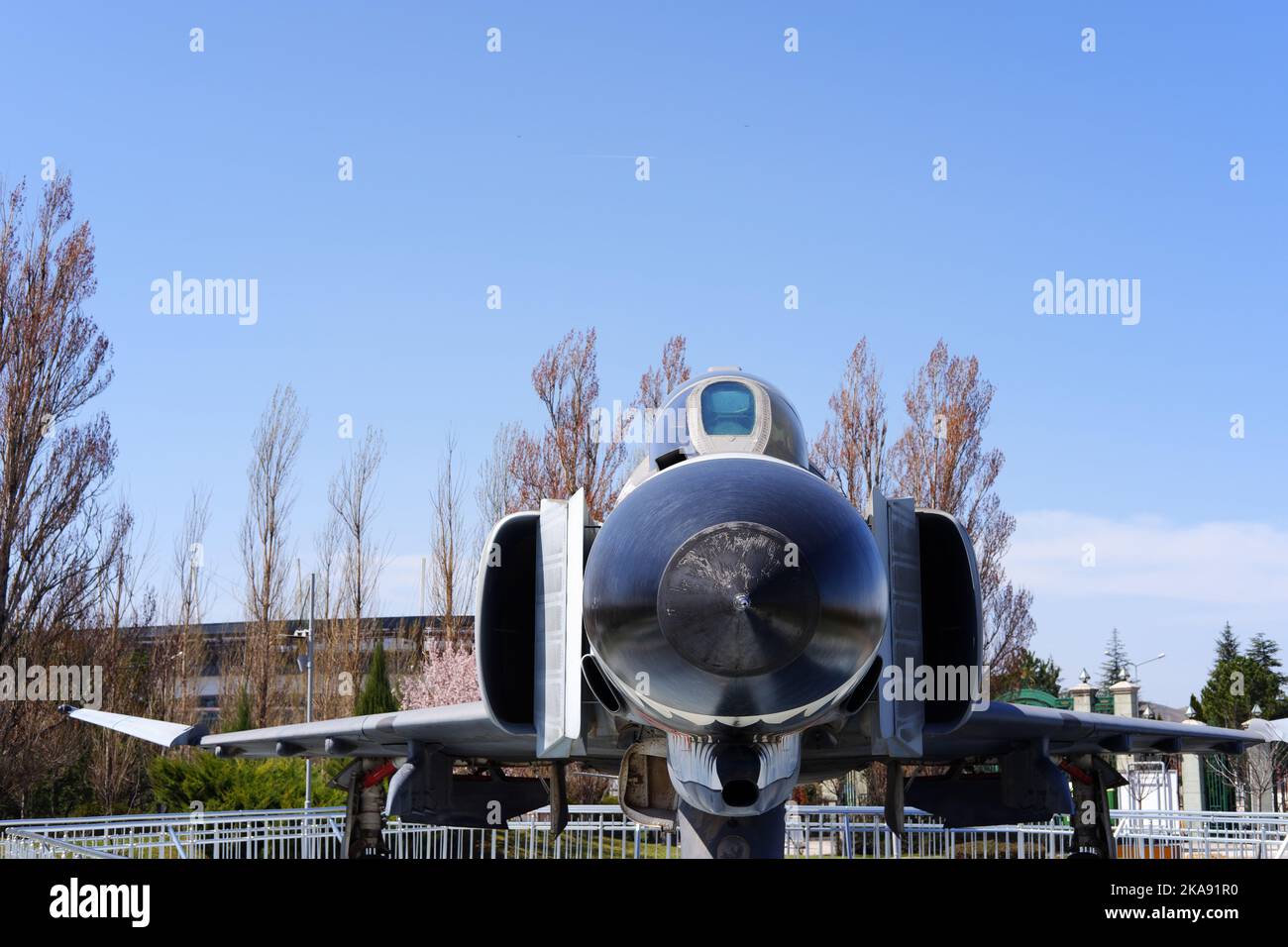 Fighter Jet front view with sky and trees at the background Stock Photo ...