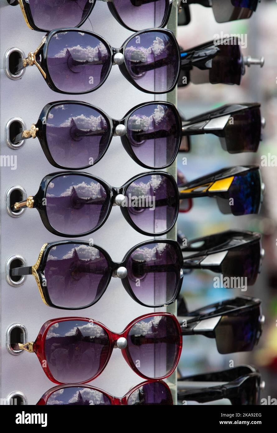 Many sunglasses on display for sale, market, female mode Stock Photo ...