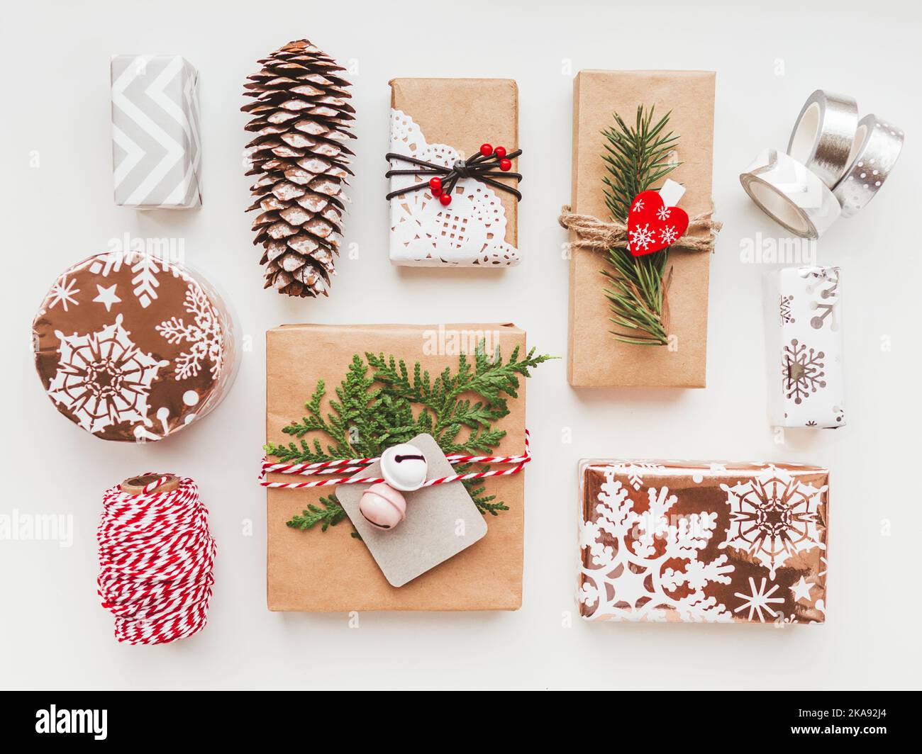 Christmas DIY presents wrapped in craft paper with fir tree twigs and ...