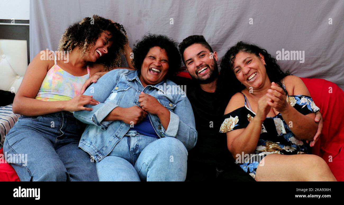 Happy Brazilian family laughing together. Casual hispanic latin people ...