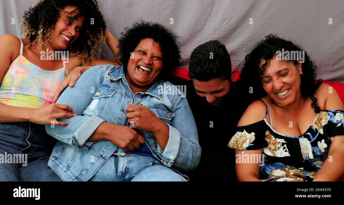 Happy Brazilian family laughing together. Casual hispanic latin people ...