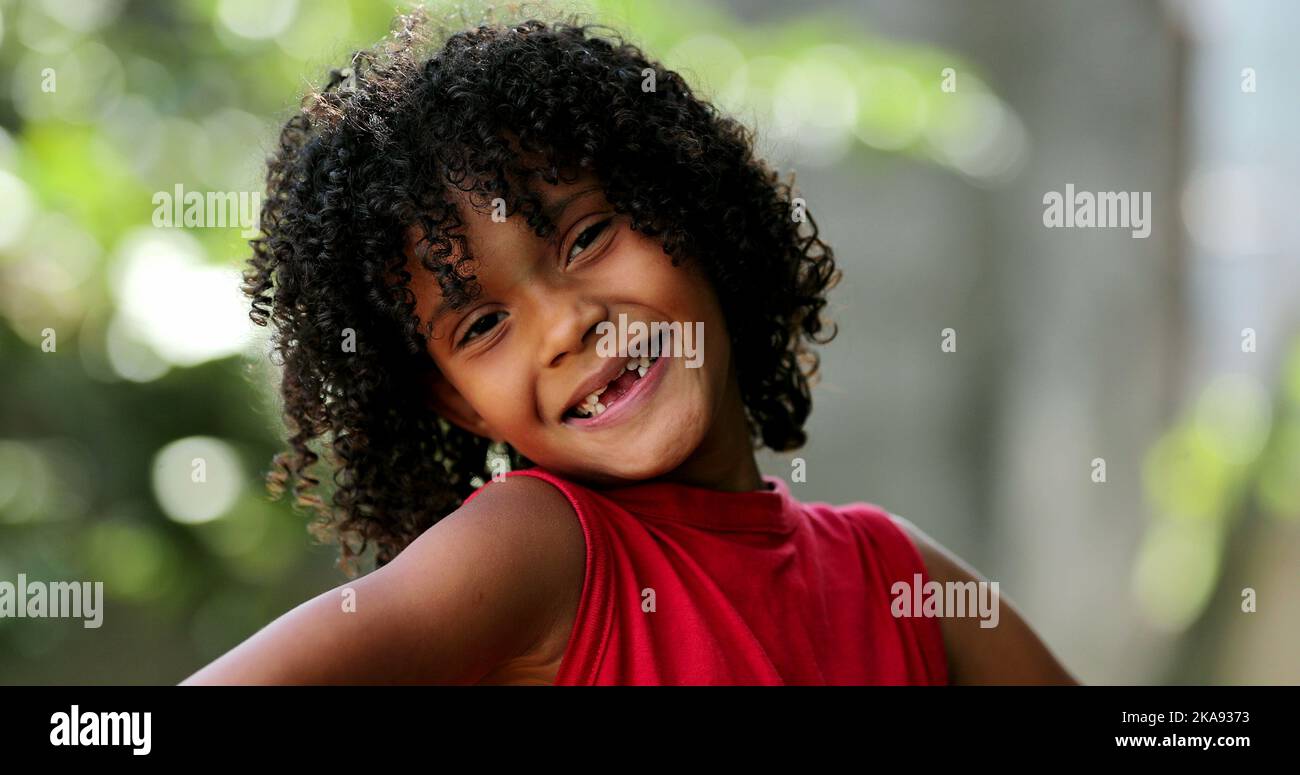 Happy Brazilian little girl child portrait smile outside with missing ...