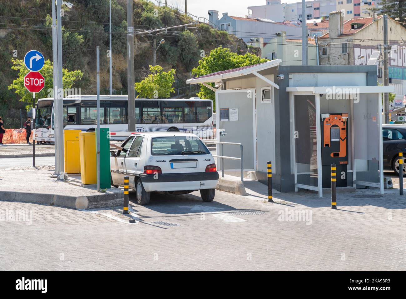 A car passing under a boom banner next to a control room Stock Photo ...