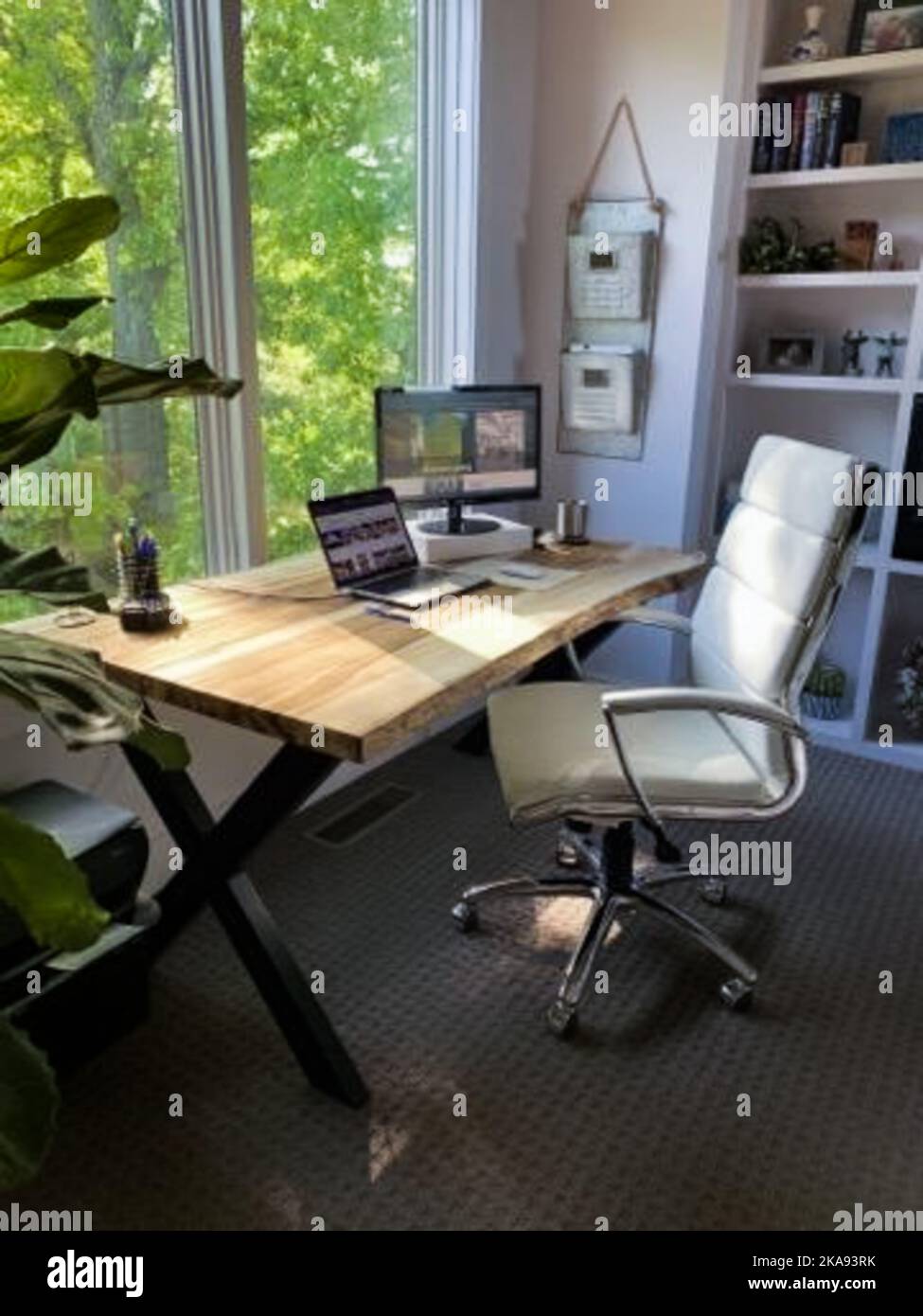 A vertical shot of a design of a home office with modern equipment and ...