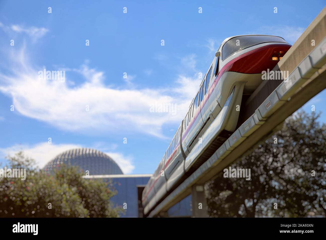A low angle shot of a red and white monorail train Stock Photo - Alamy