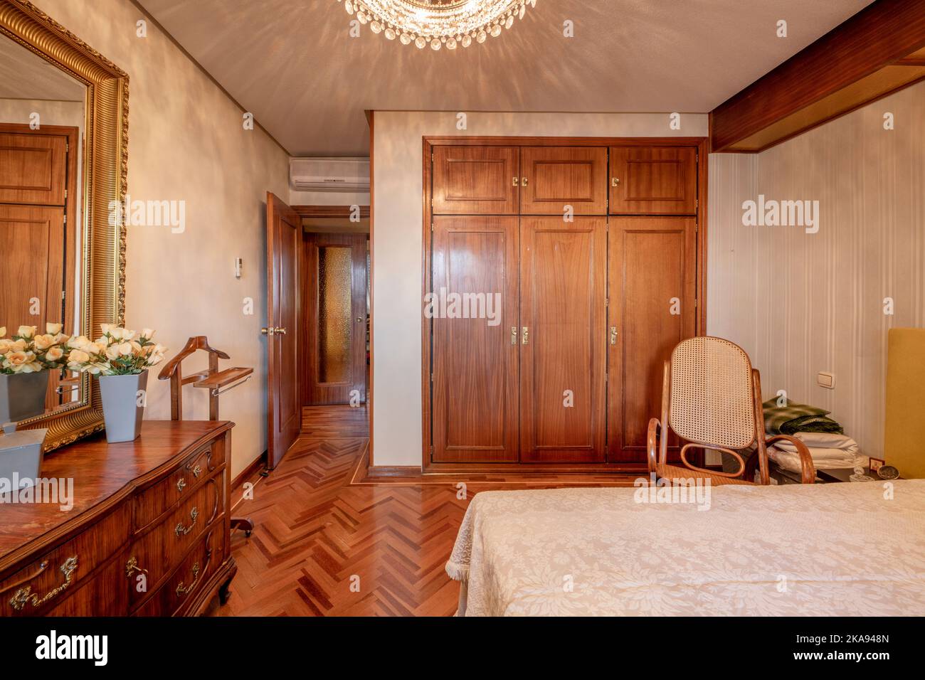 Vintage decorated bedroom with root wood furniture and three-door built ...