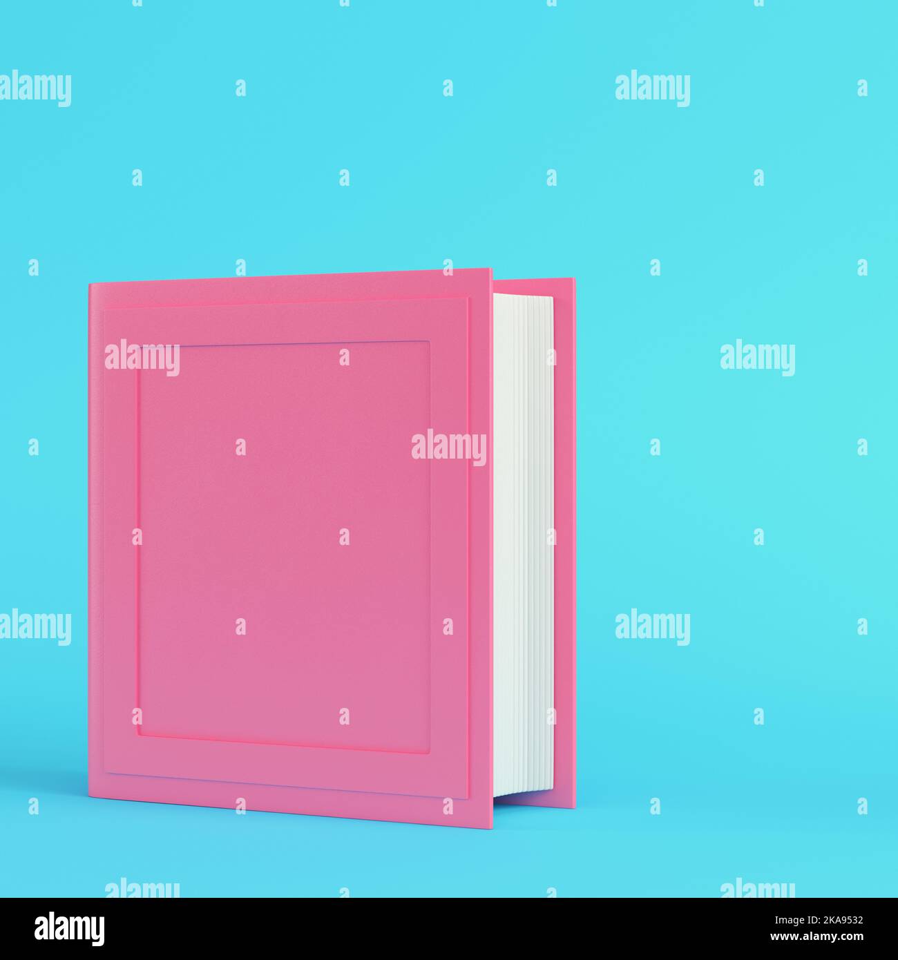 Pink hard covered book on bright blue background in pastel colors ...