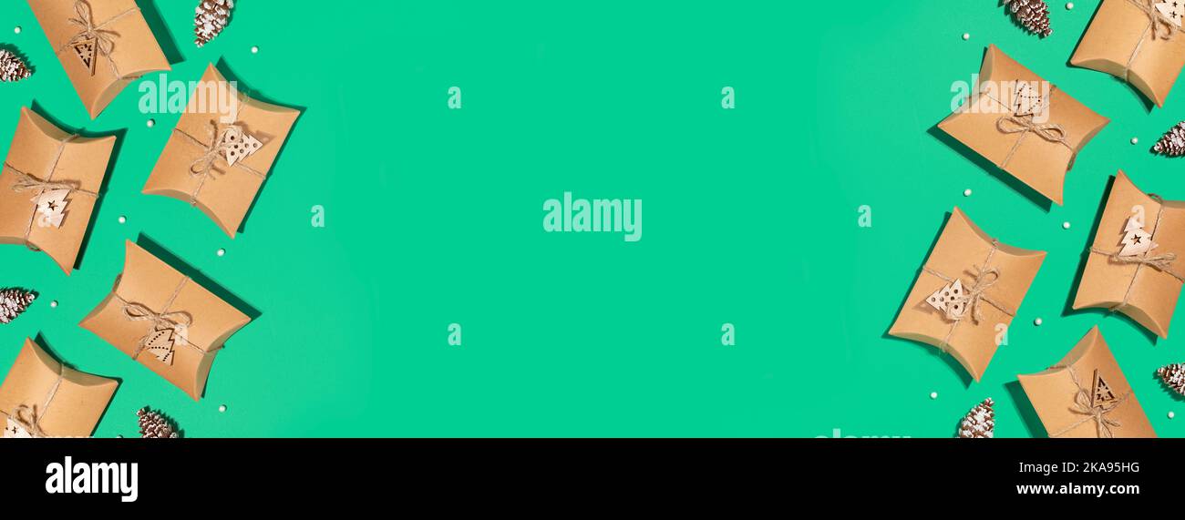 Christmas eco friendly banner. Craft gift boxes with decoration on a ...