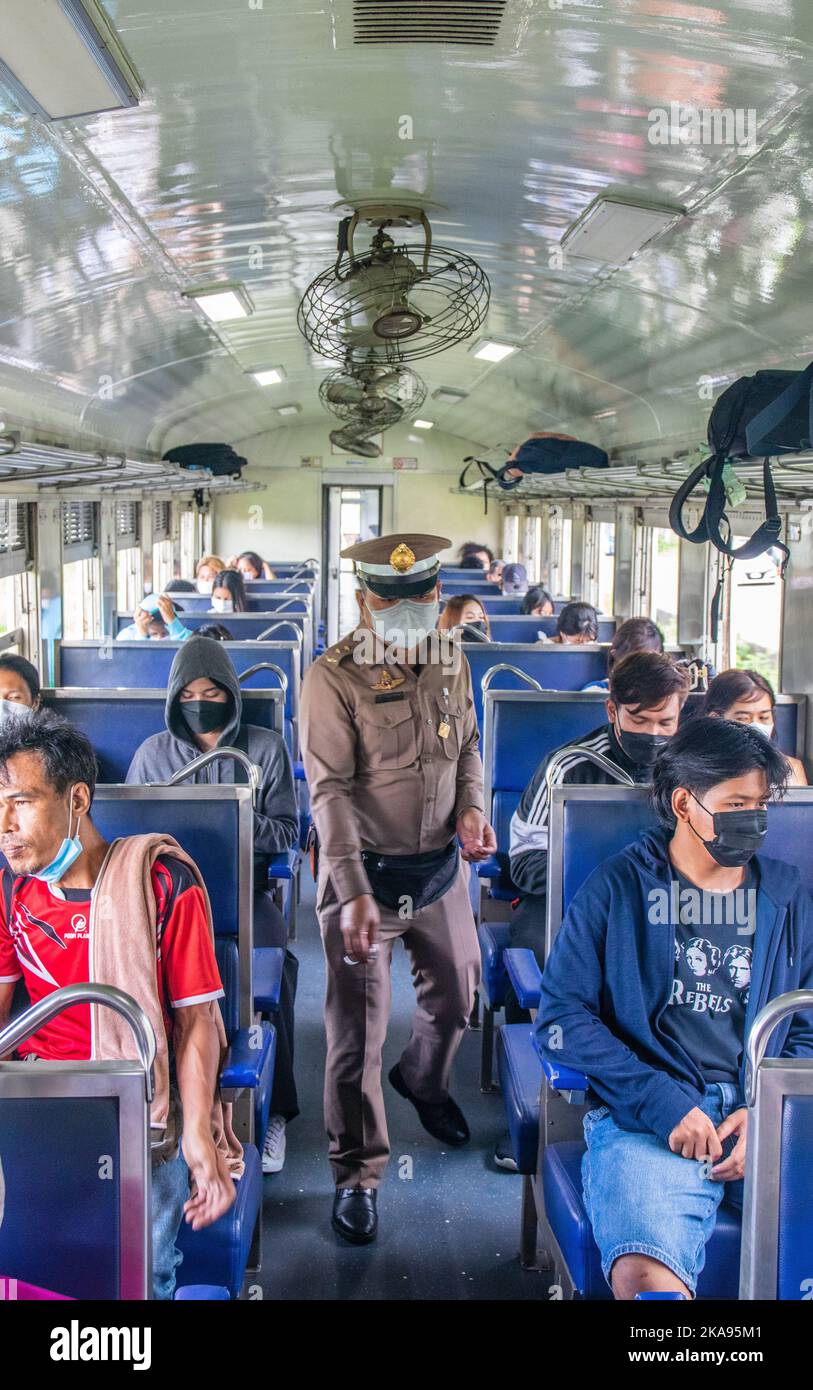 People and a conductor in a train wagon in Thailan Stock Photo - Alamy