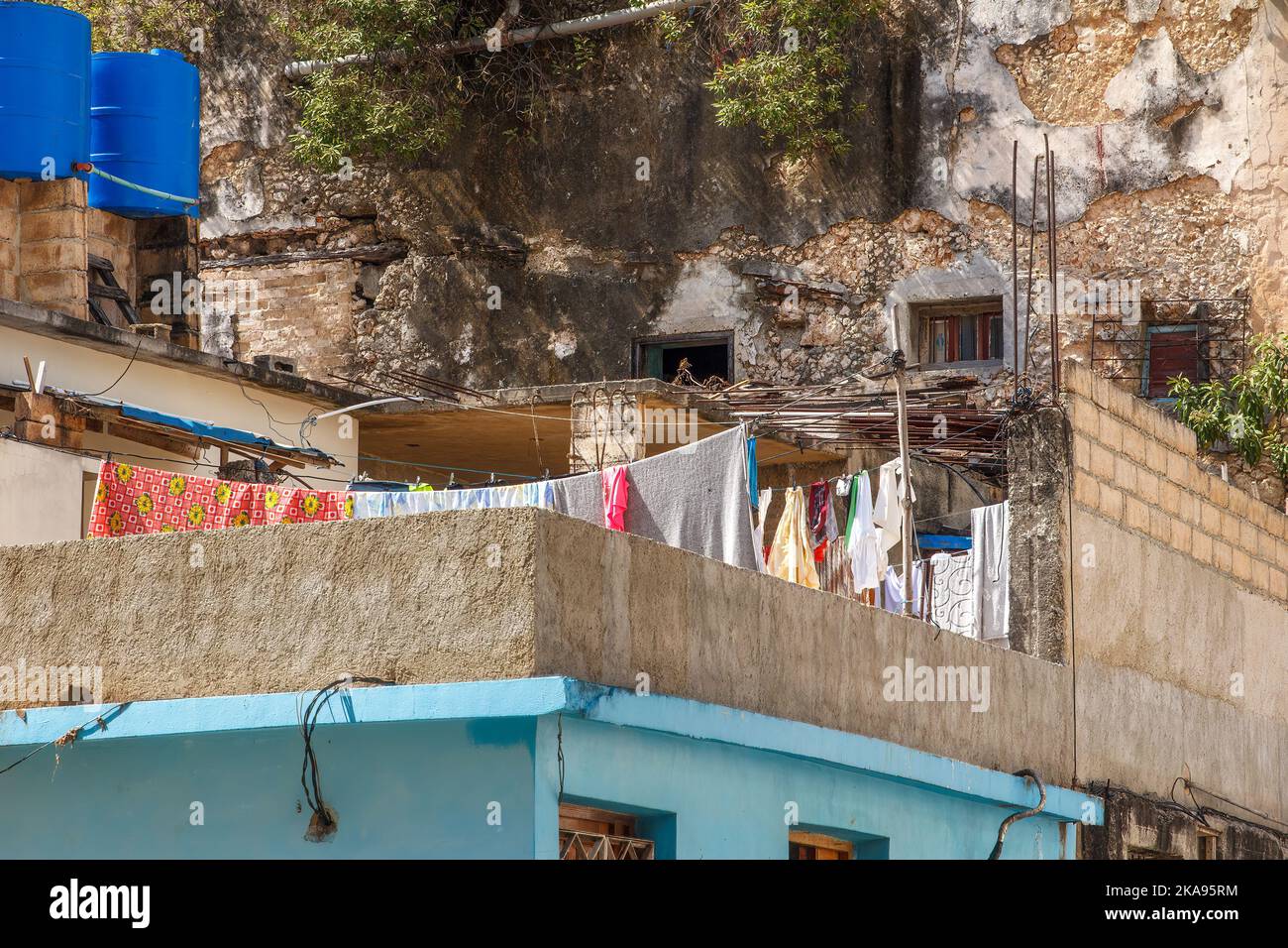 Clothesline of drying clothes on a rooftop of a house. A weathered and ...