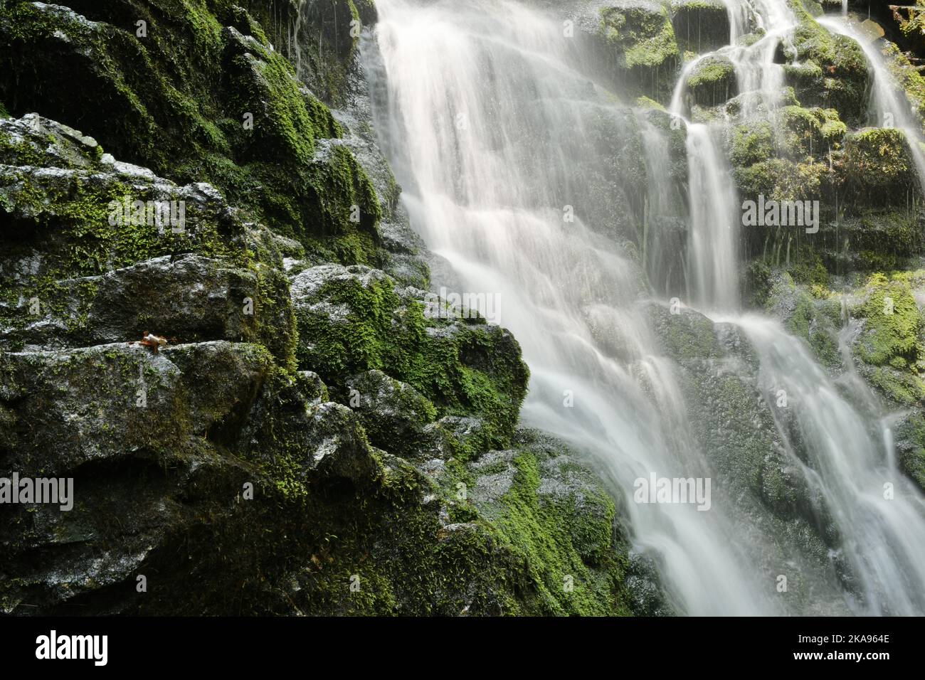 A closeup of a beautiful waterfalls in the rocky cliff Stock Photo - Alamy
