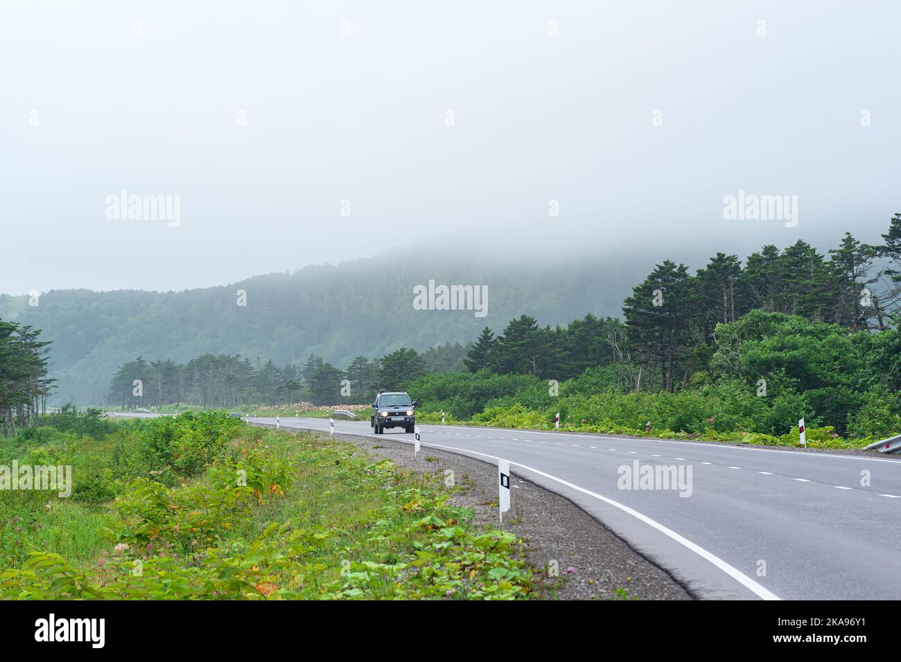 Yuzhno-Kurilsk, Russia - August 03, 2022: highway through foggy wooded ...