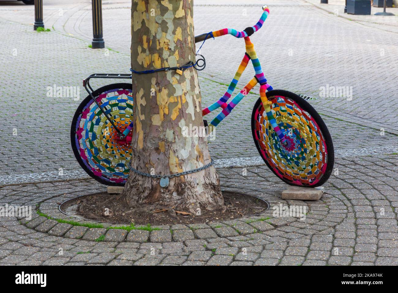 Colourful yarn bombing bike, yarn bomb crochet crocheted bike against ...