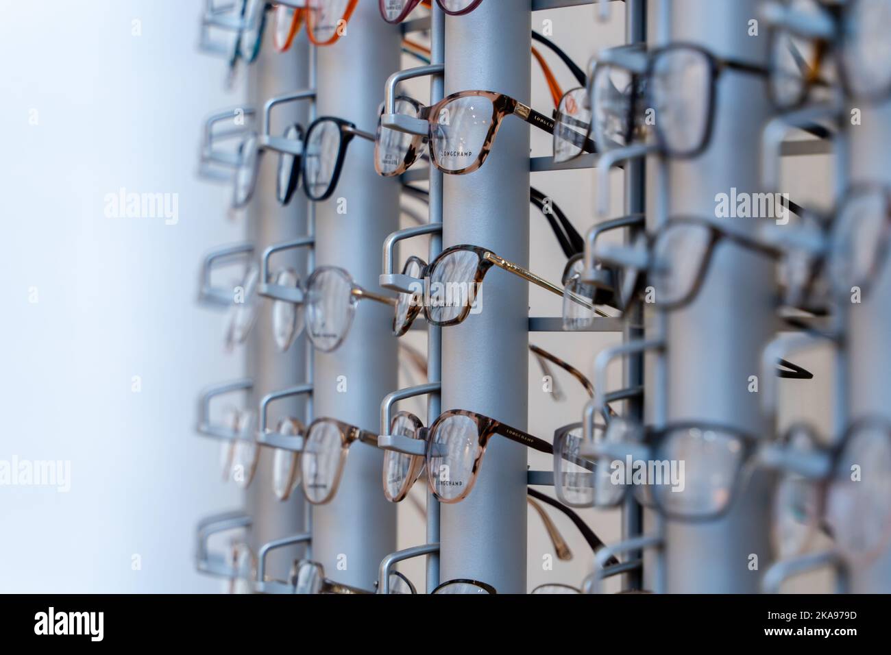 Designer spectacles or glasses frames on display in an opticians store ...