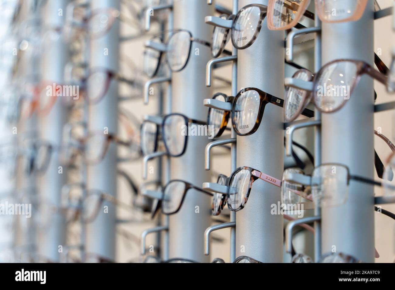 Designer spectacles or glasses frames on display in an opticians store ...