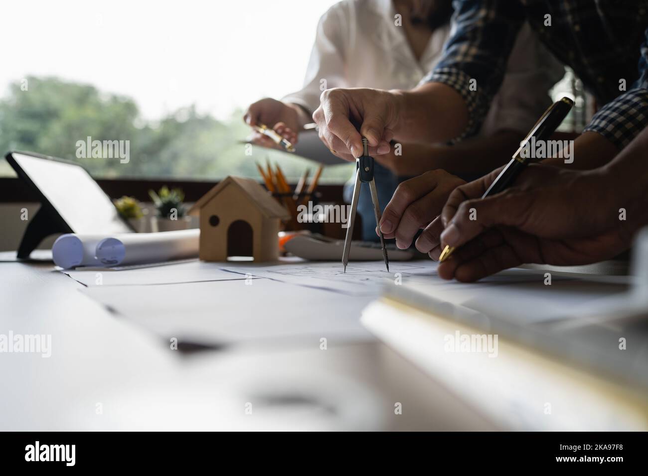 Architect man working with blueprints for architectural plan, engineer ...