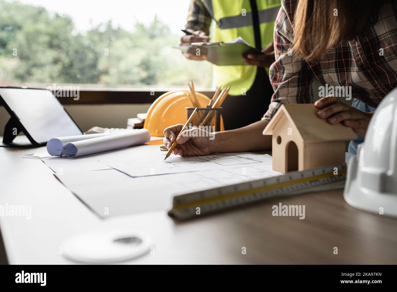 Architect man working with blueprints for architectural plan, engineer ...