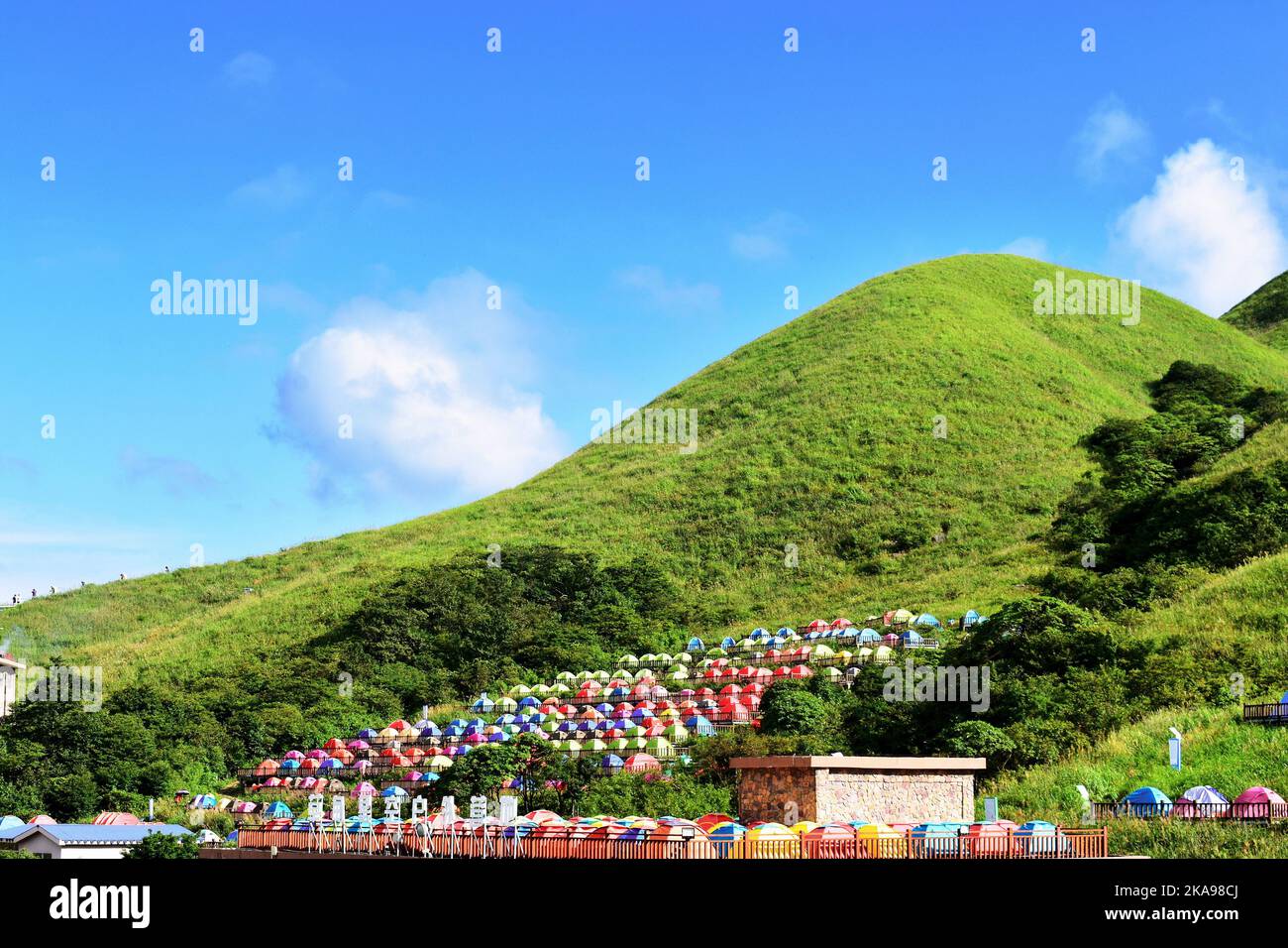 The colorful pavilions on the green Wugong Mountain during a camping ...