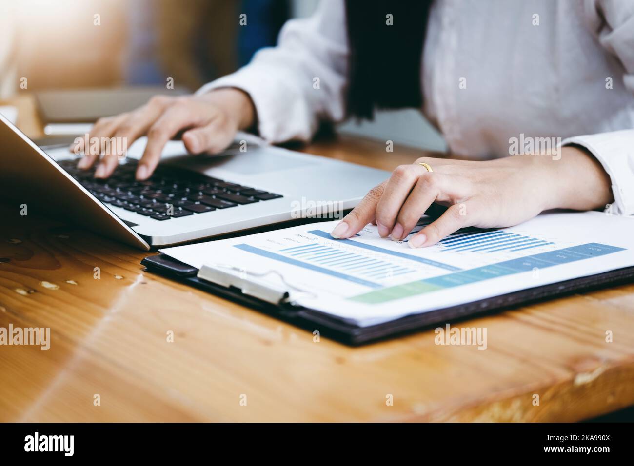 Business woman pointing document to review balance sheet annual and use ...