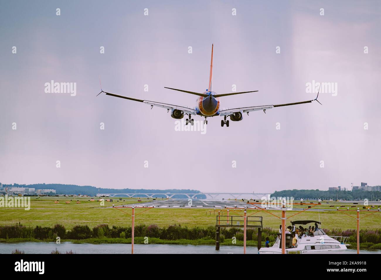 An airplane preparing for landing at the airport Stock Photo - Alamy
