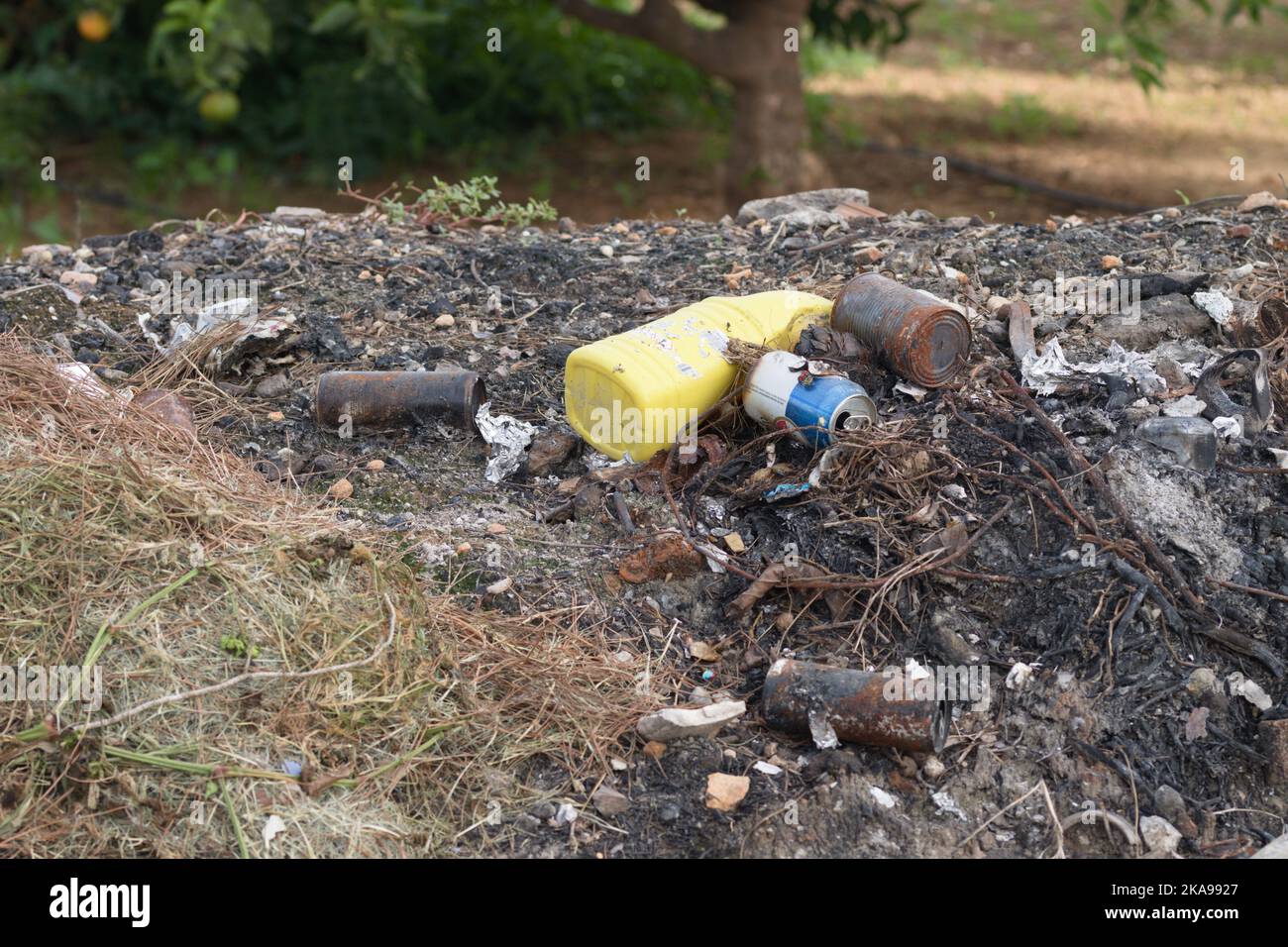 Image of the remains of a bonfire where household garbage, plastic ...