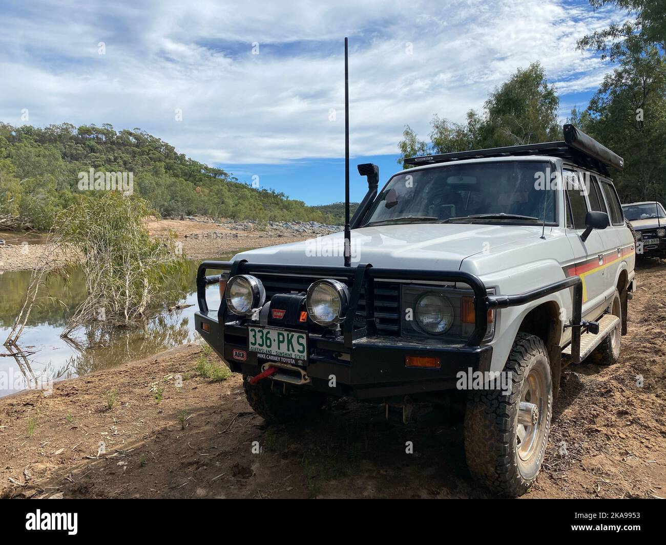 An old white 4WD on a remote track along the Gilbert River in North ...