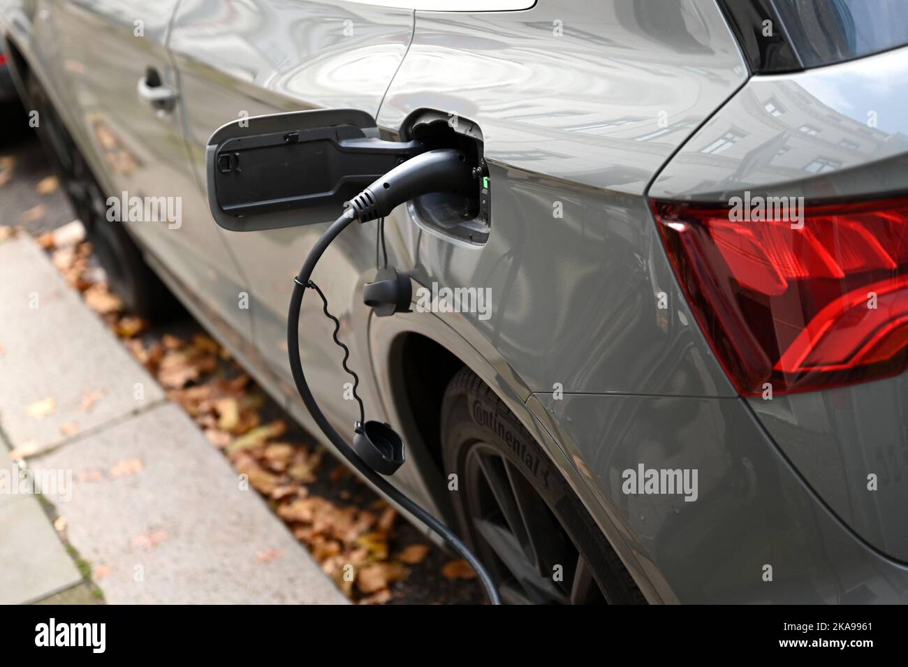 Electric car charging the battery Stock Photo - Alamy