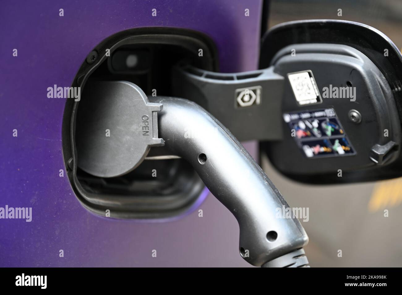 Electric car charging the battery Stock Photo - Alamy