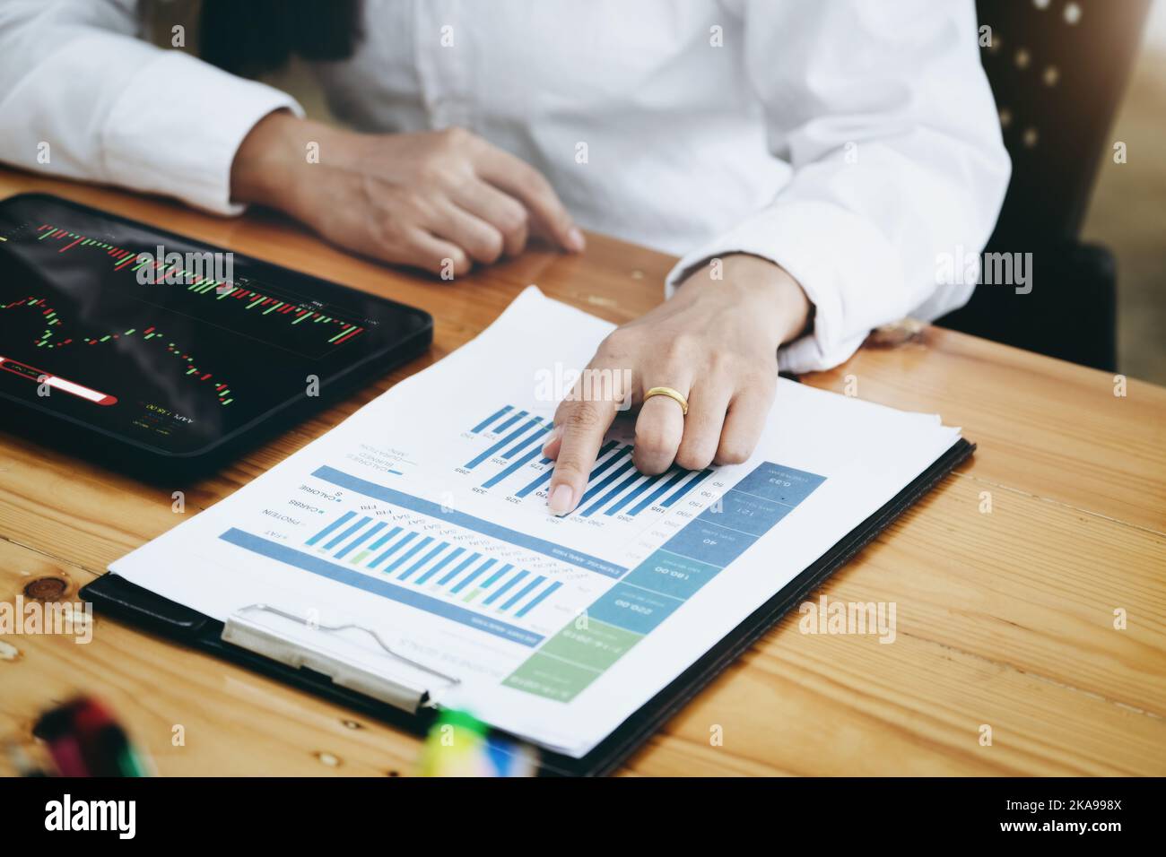 New normal, self-employed women pointing document stock and using a ...