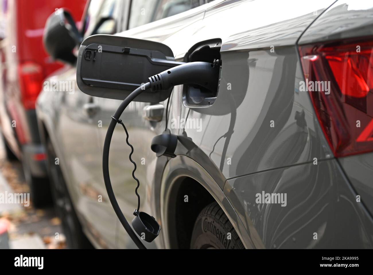 Electric car charging the battery Stock Photo - Alamy
