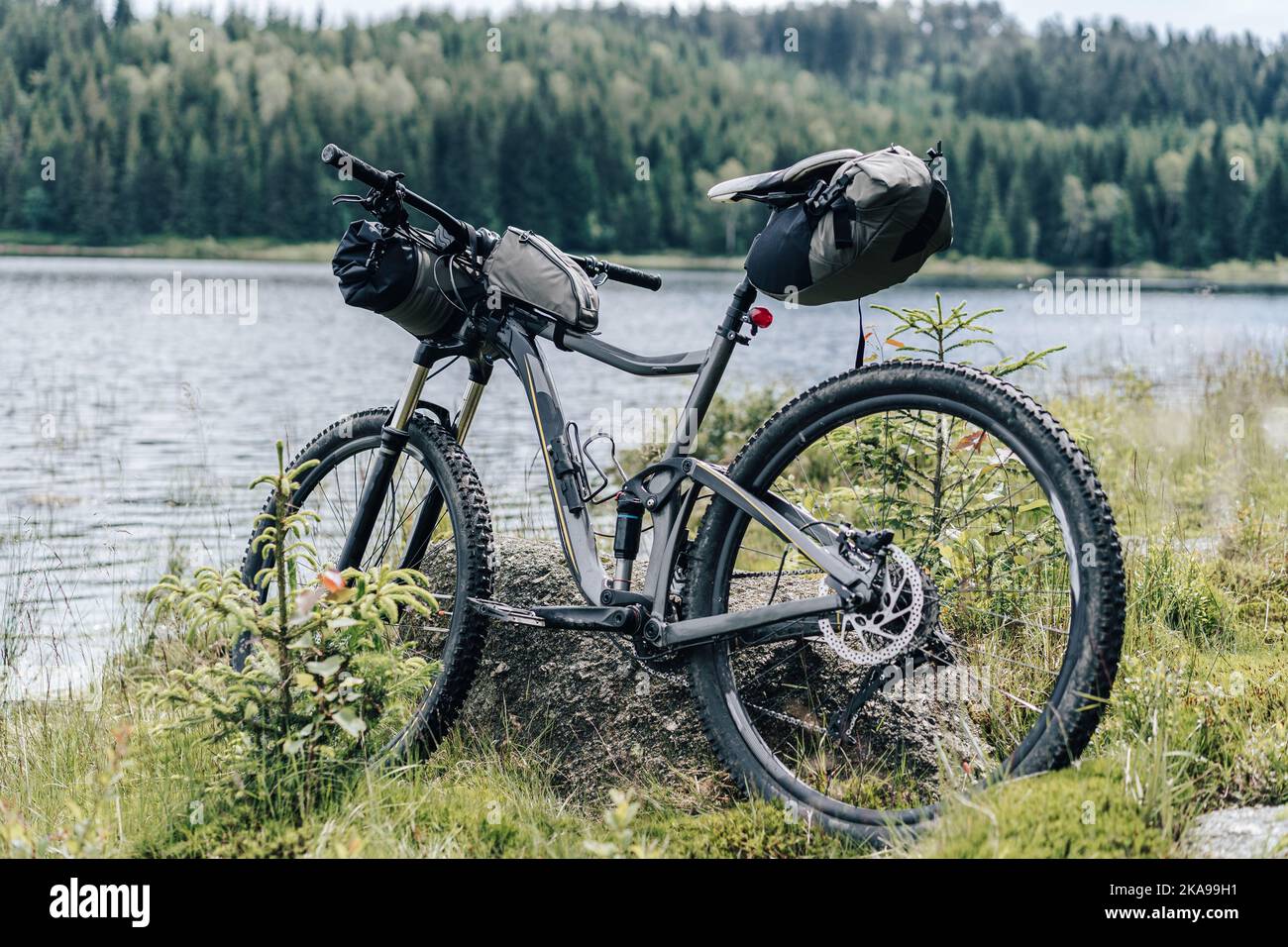 Bikepacking equipment on a mountain bike. Mountain bike with packed ...