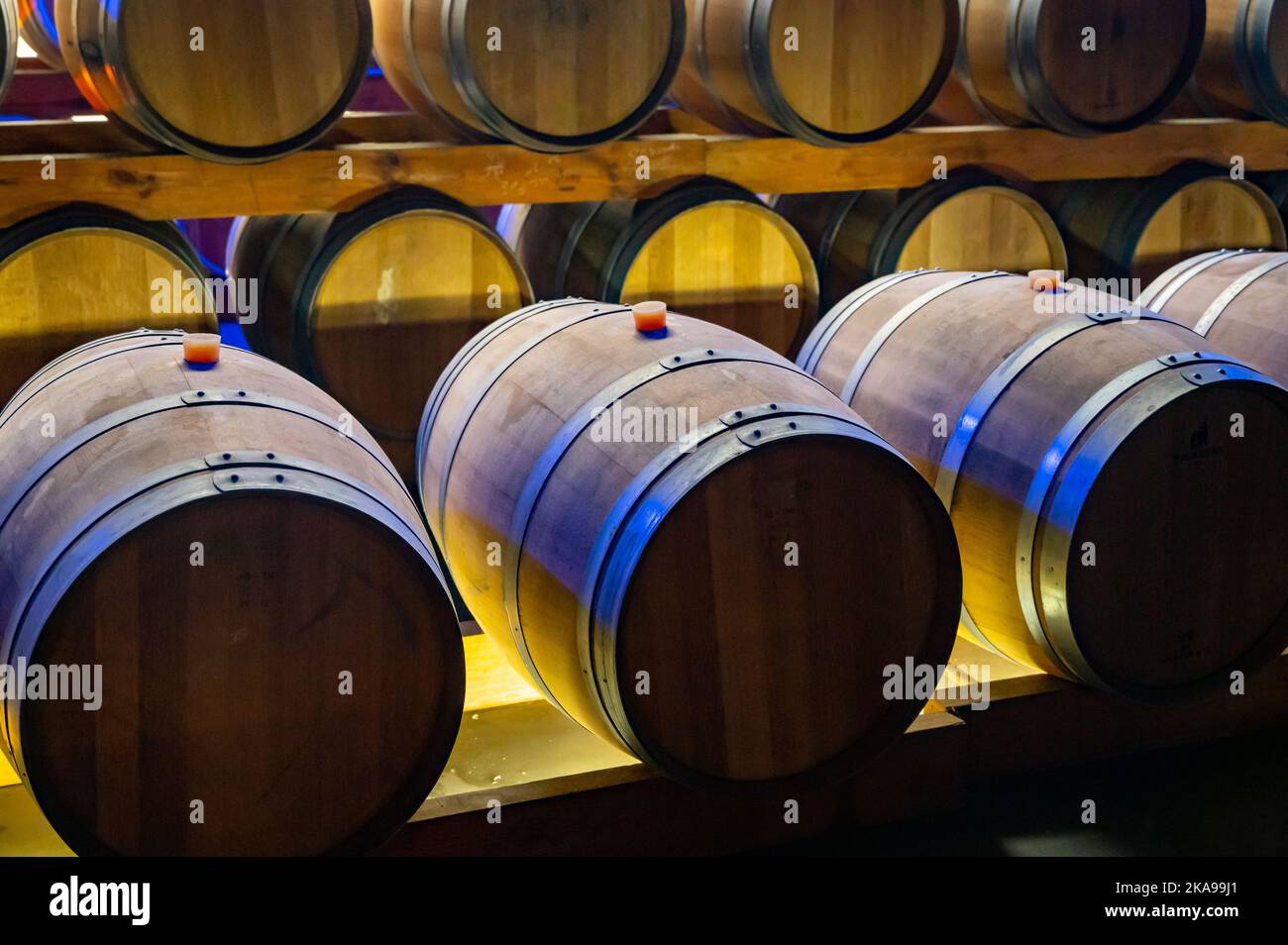 Walking in deep long undergrounds caves with wooden barrels, making ...