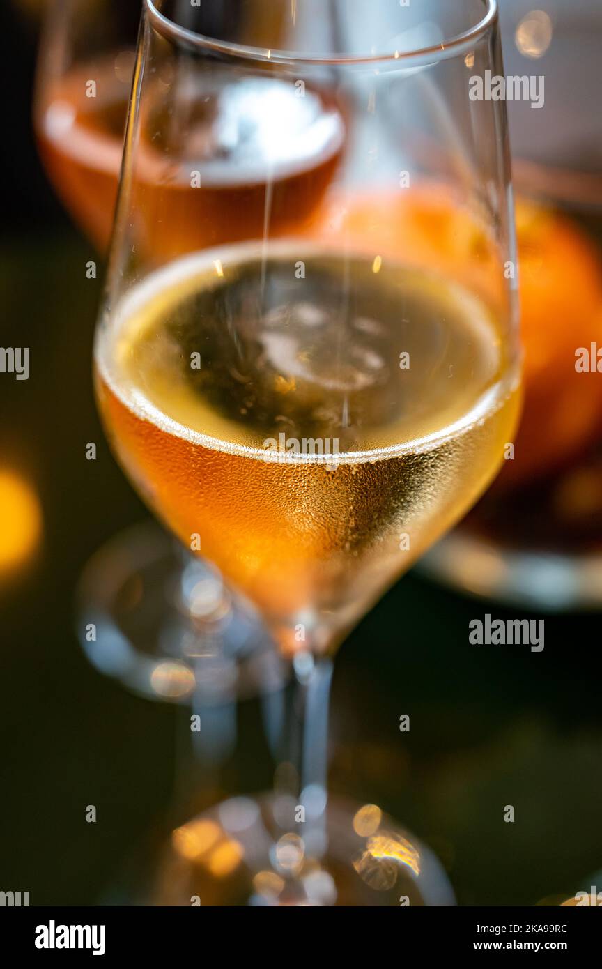 Tasting of brut and rose champagne sparkling wine produced by traditional method in underground ...