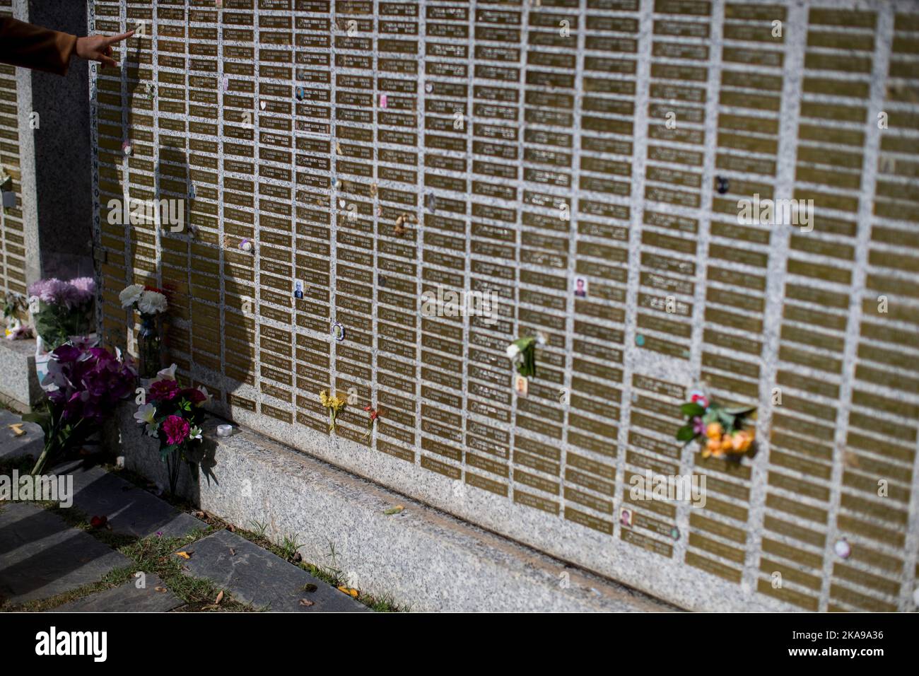 Madrid, Spain. 01st Nov, 2022. A woman points to a plaque in the mural ...