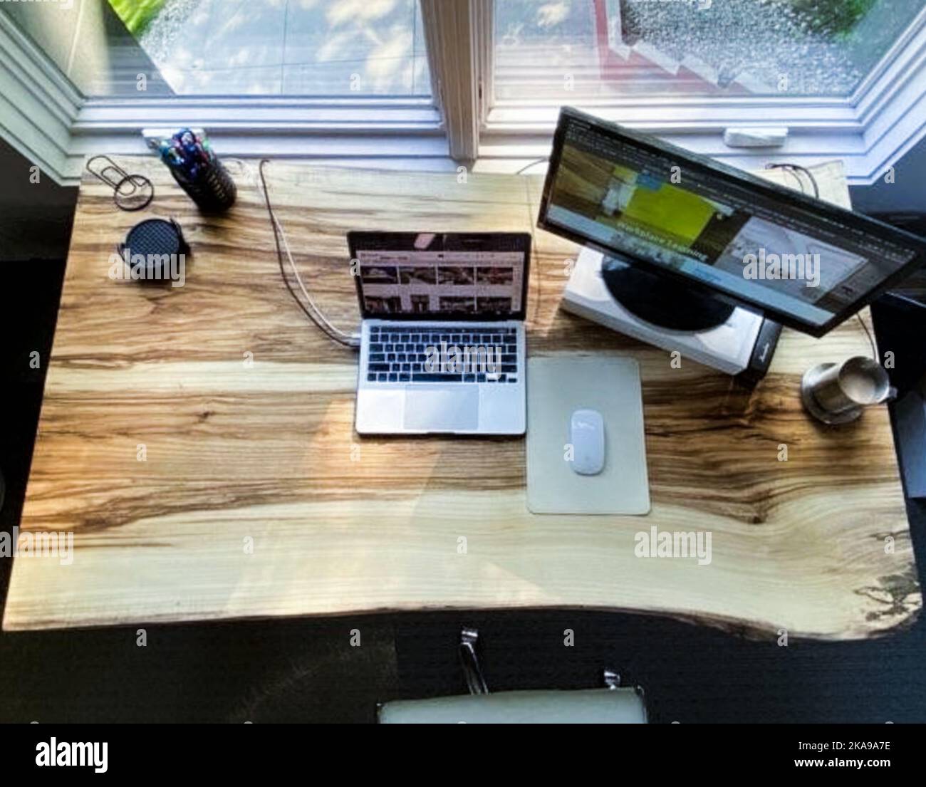 A top view of a desk at a home office with modern equipment and objects ...
