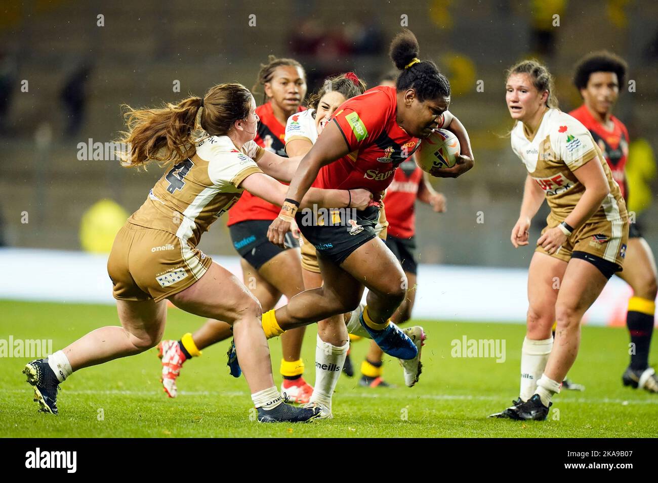 Papua New Guinea's Essay Banu breaks through the Canada wall during the ...