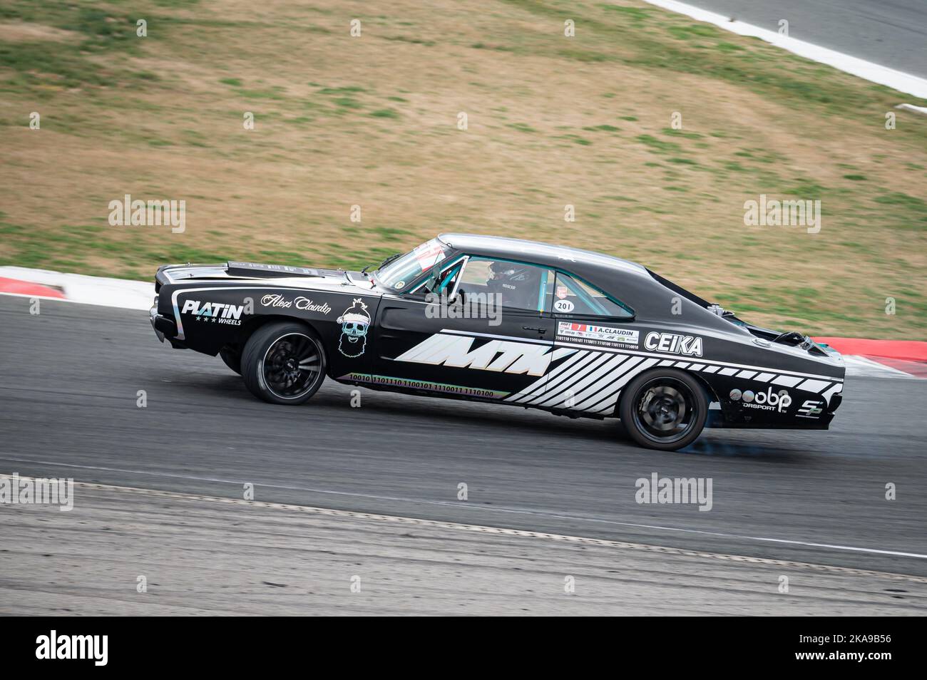 Dodge Charger drifting on the race track Stock Photo - Alamy