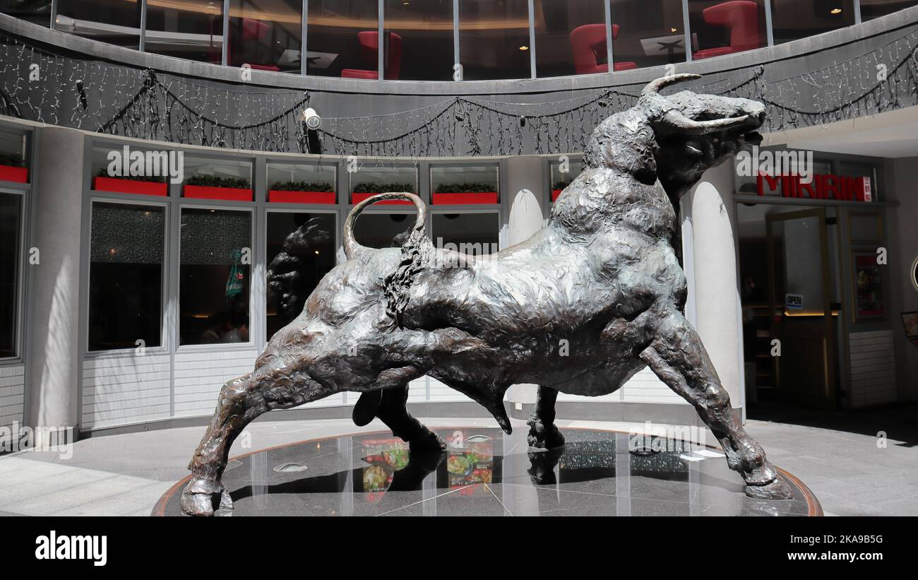 A statue of a bull outside a restaurant Stock Photo - Alamy