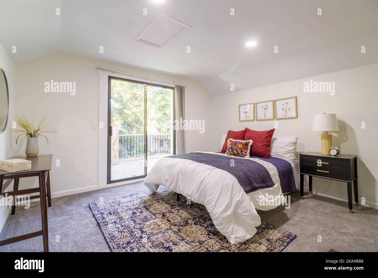 An interior of a newly renovated bedroom with a big window and a double ...