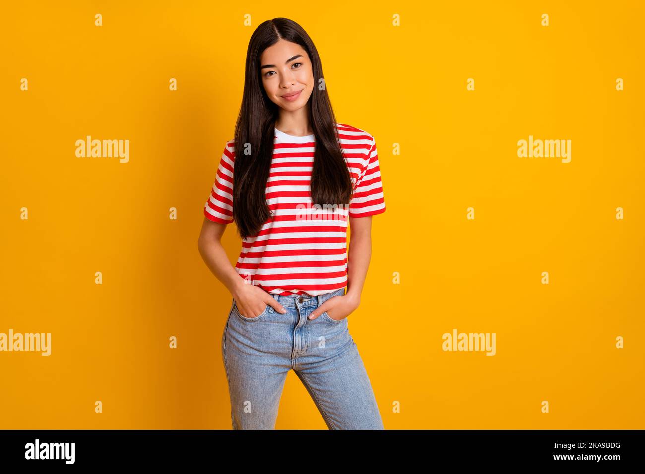 Photo of pretty charming young lady wear red clothes arms pockets empty ...