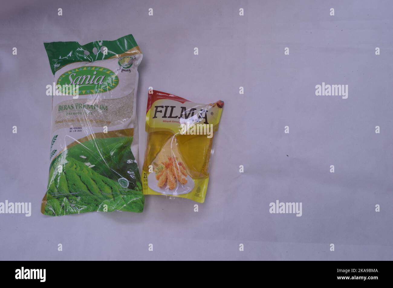 Packaged rice and cooking oil on a white background Stock Photo - Alamy