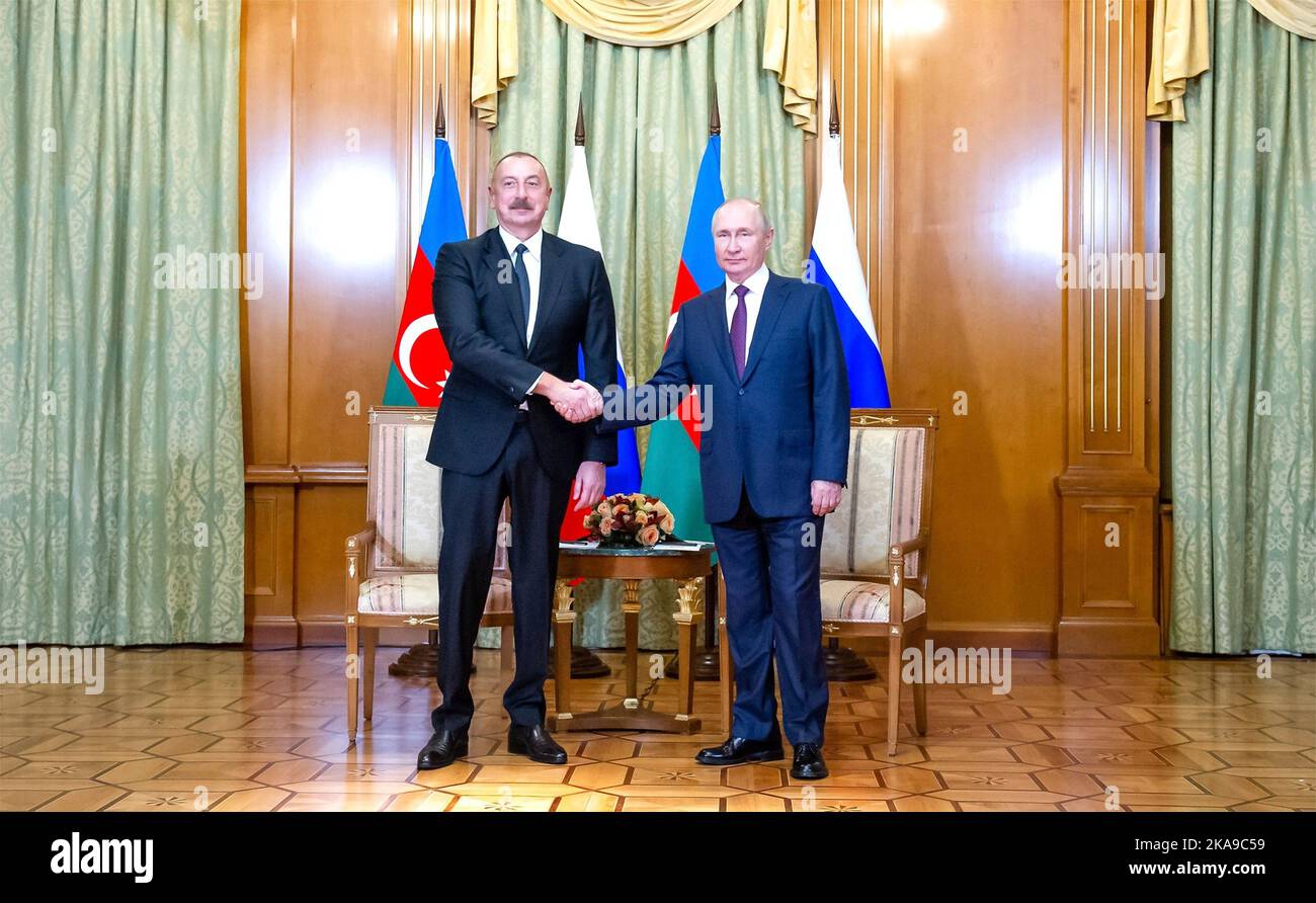 Sochi, Russia. 31st Oct, 2022. Russian President Vladimir Putin shakes ...