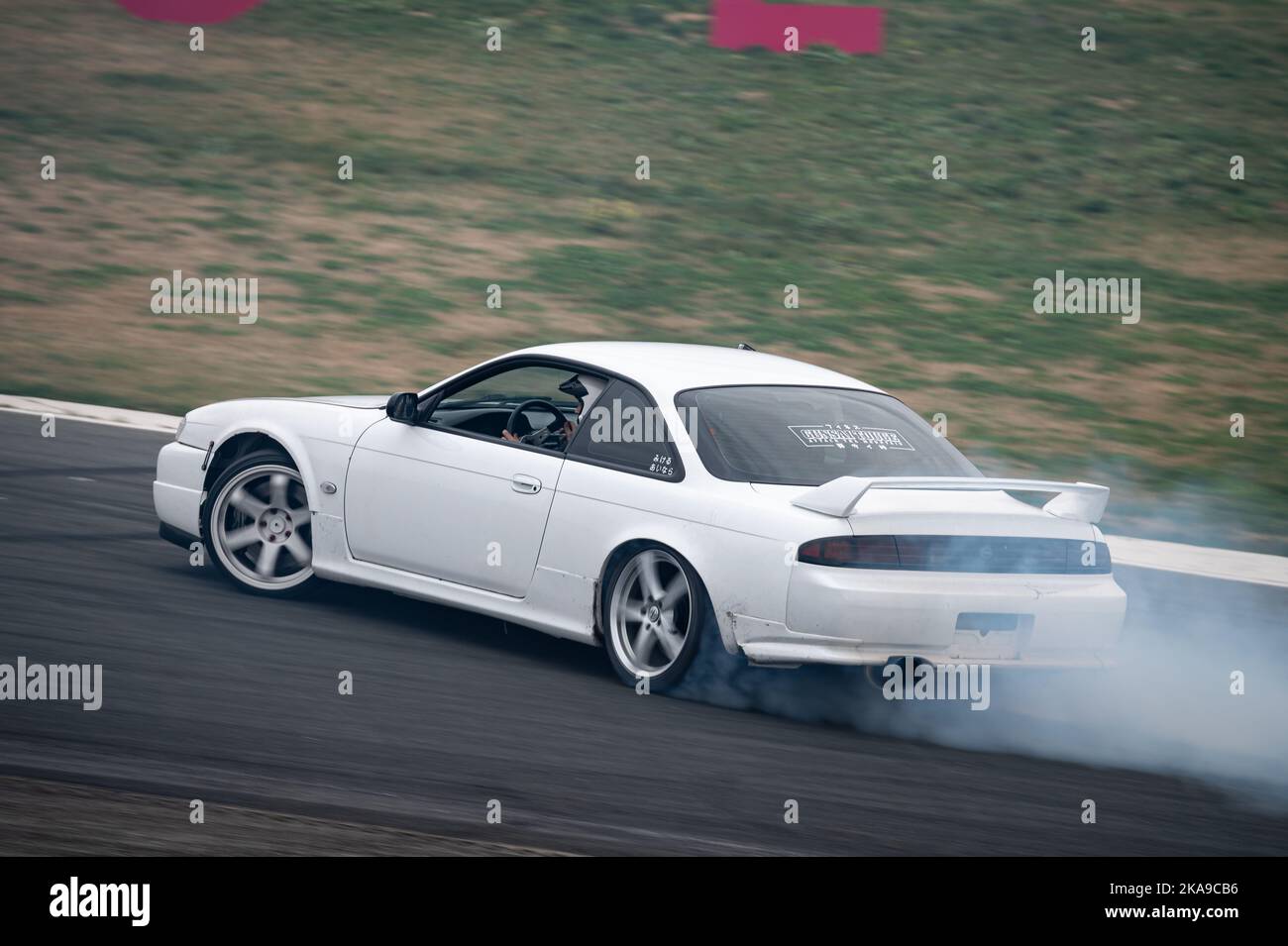 Nissan Silvia S14 drifting on the racing circuit Stock Photo - Alamy