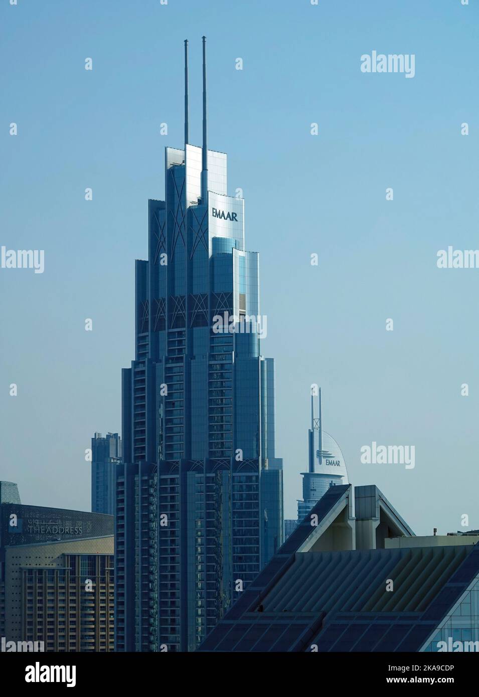 A vertical shot of Address Boulevard Hotel under a clear blue sky in ...