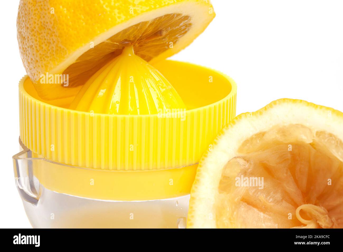 Manual Juicer with lemon isolated on white background Stock Photo - Alamy