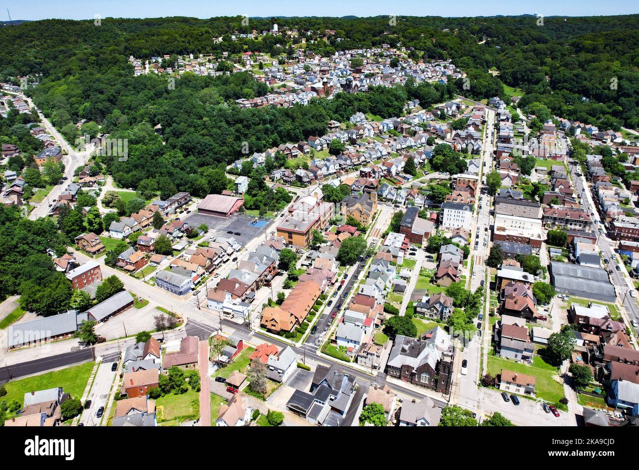 The bird's eye view of the residential area surrounded by green ...