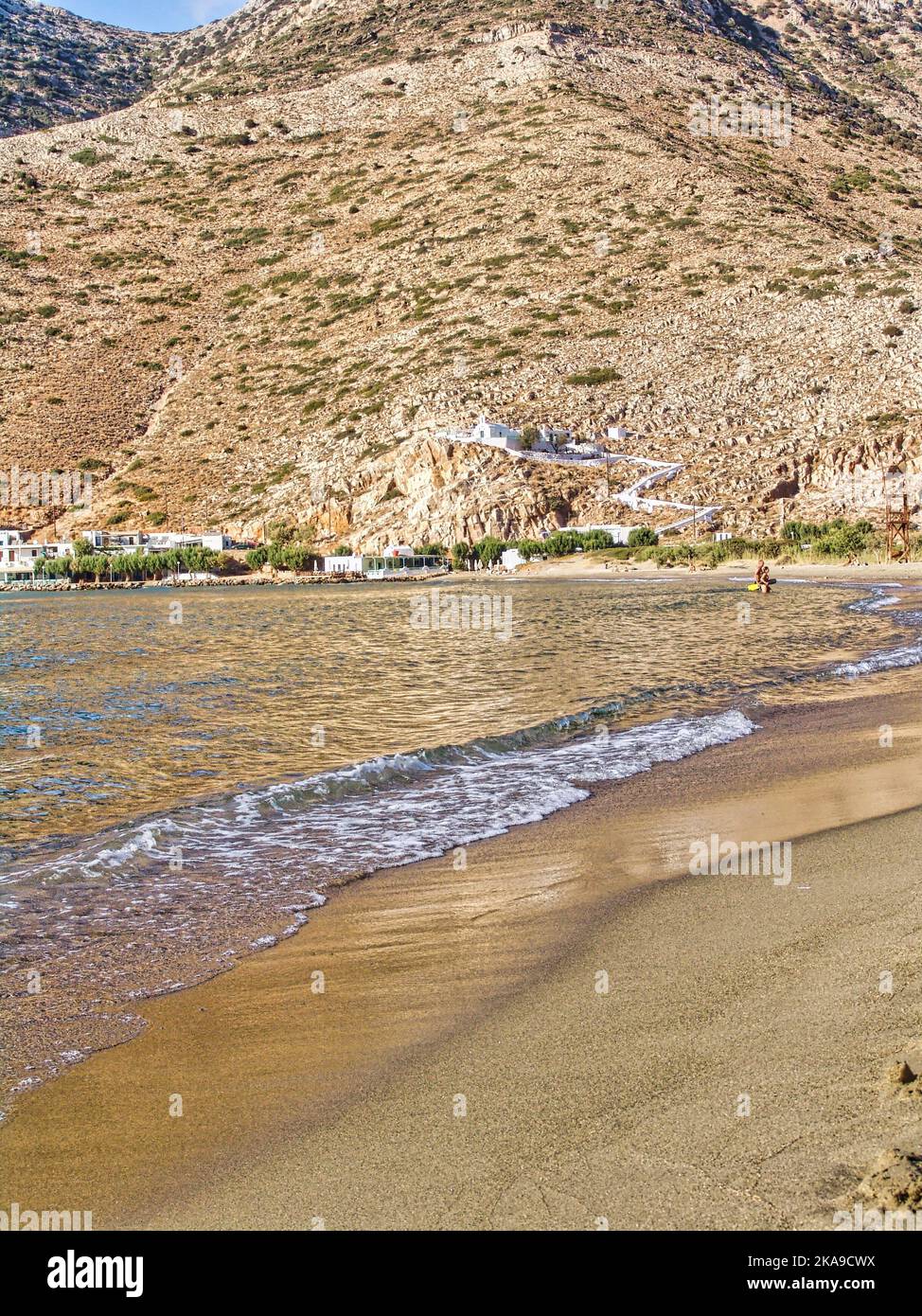 A vertical view of a beach with mountains in Kameras village, Sifnos ...