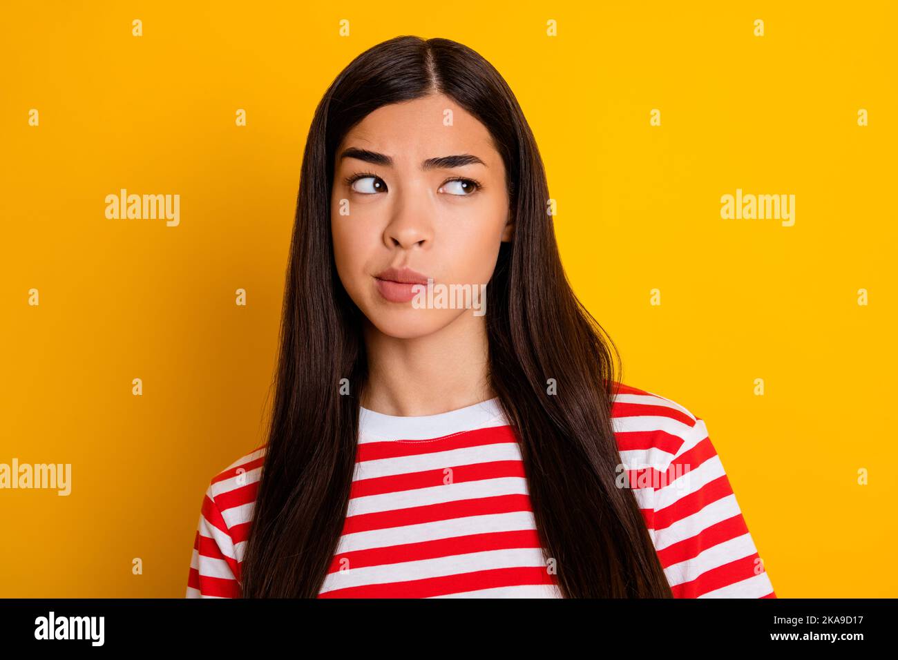 Photo of doubtful unsure young lady wear red clothes looking empty ...