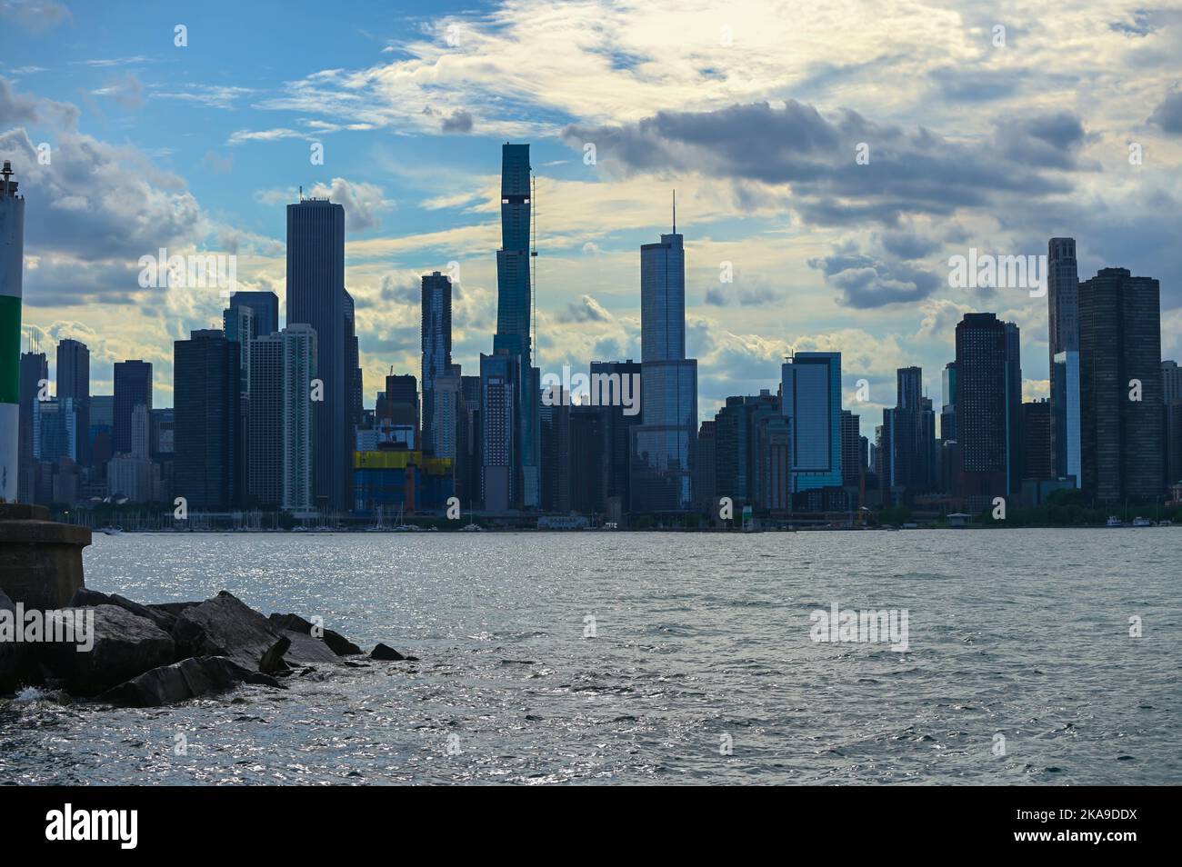 A breathtaking cityscape of modern buildings surrounded by water in ...