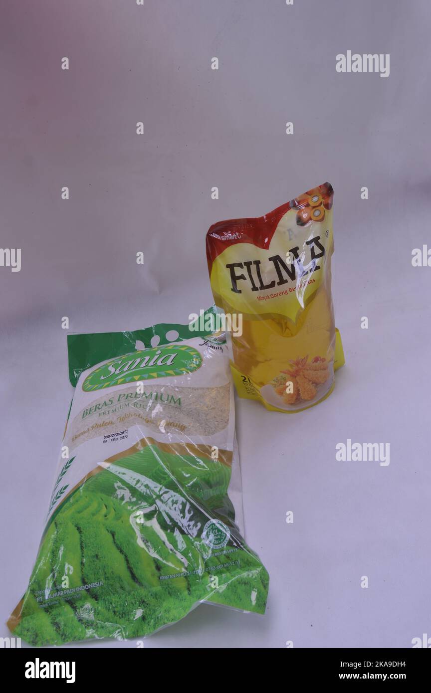 Packaged rice and cooking oil on a white background Stock Photo - Alamy